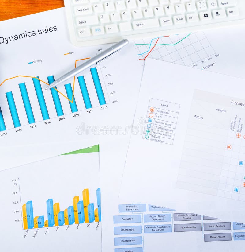 Desktop with Graphic Chart Diary and Glasses and Pen Stock Photo ...