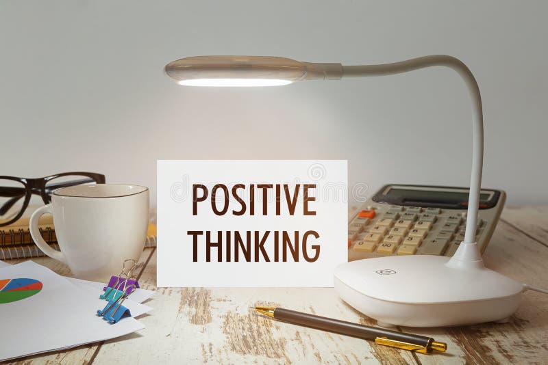 Desktop with a Lamp that Illuminates the Inscription Positive Thinking ...