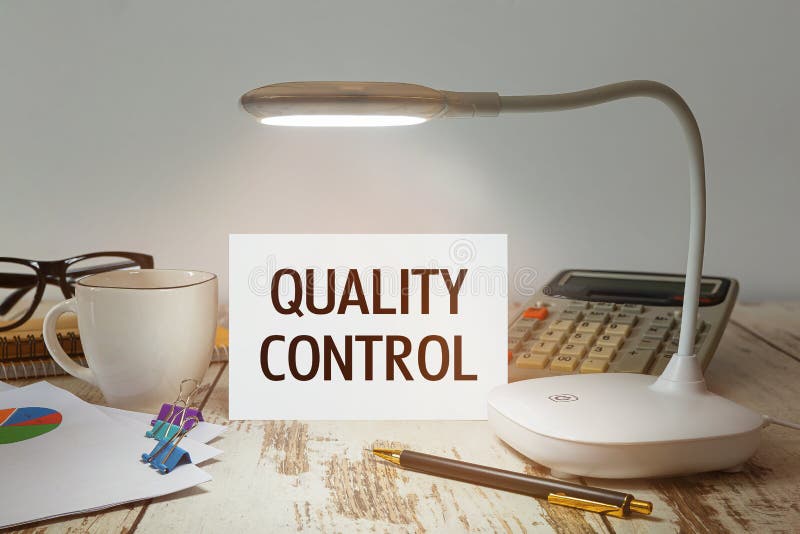 Desktop with a Lamp that Illuminates the Inscription Quality Control ...