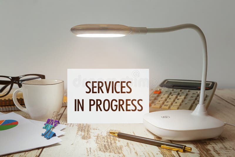 Desktop with a Lamp that Illuminates the Inscription Services in ...