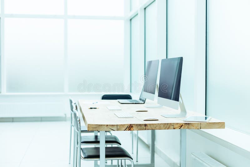Desktop with Laptop and Computers in an Empty Office. Stock Photo ...