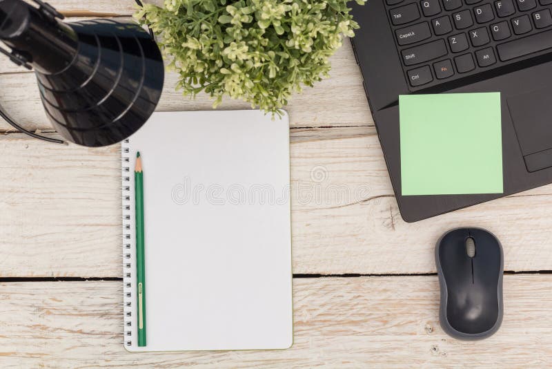 Desktop: Laptop and Notepad Stock Image - Image of laptop, plant: 67597385