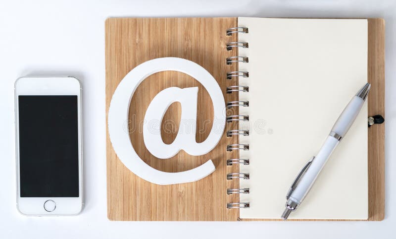 Desktop with Notepad and Glasses and Email Symbol. Top View Stock Photo ...