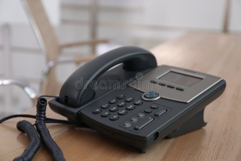 Desktop Telephone on Wooden Table in Office. Hotline Service Stock ...