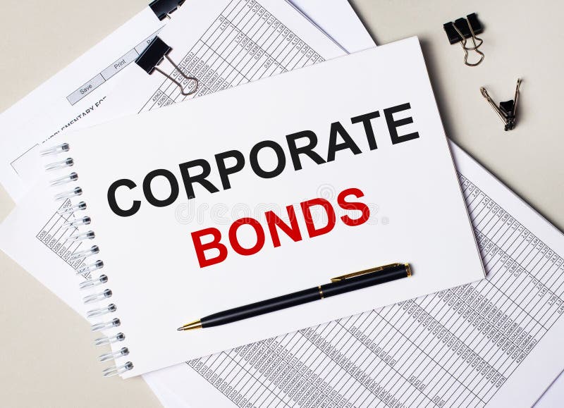 On the Desktop There are Documents, Pen, Black Paper Clips and a ...