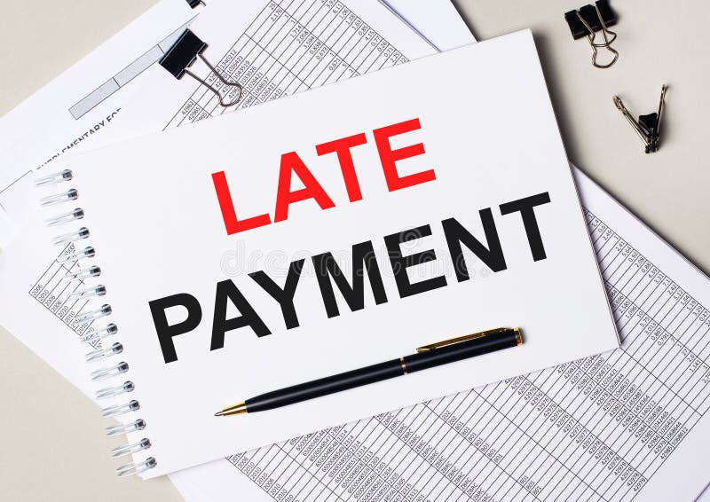 On the Desktop There are Documents, Pen, Black Paper Clips and a ...