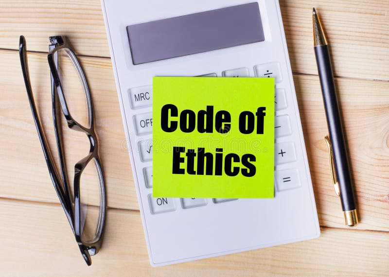 On the Desktop There is a Green Sticker with the Text CODE of ETHICS, a ...