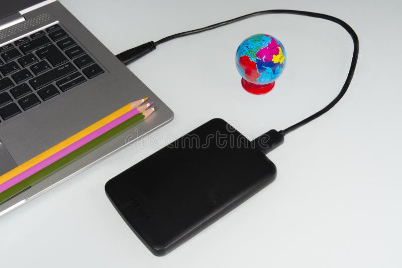 Desktop with World and Hard Drive Connected To a Computer through the ...
