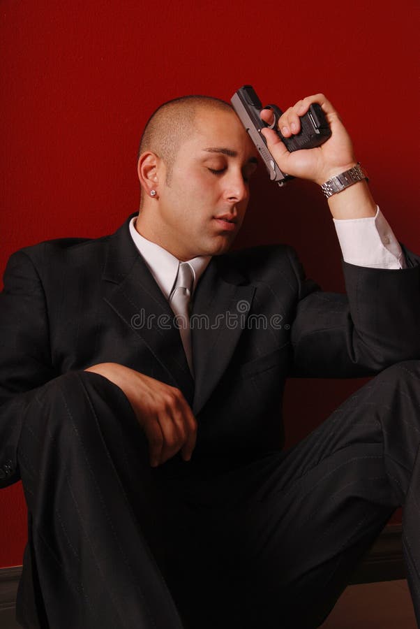 Despairing man with gun. stock photo. Image of masculine - 7165250