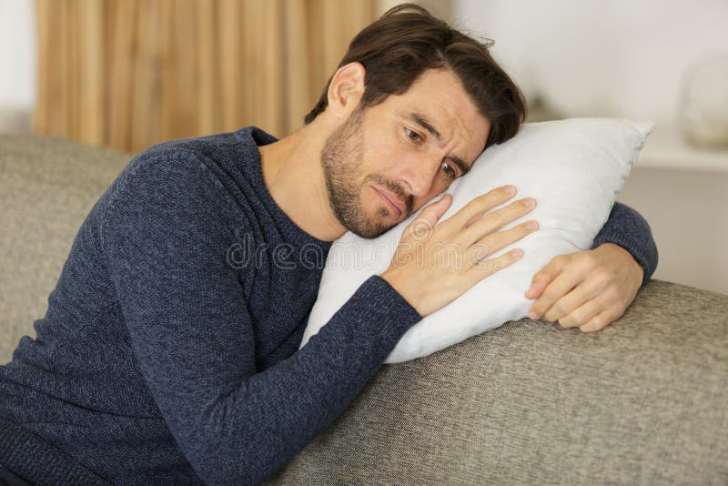 Desperate Man at Home Sitting at Living Sofa Couch Stock Photo - Image ...