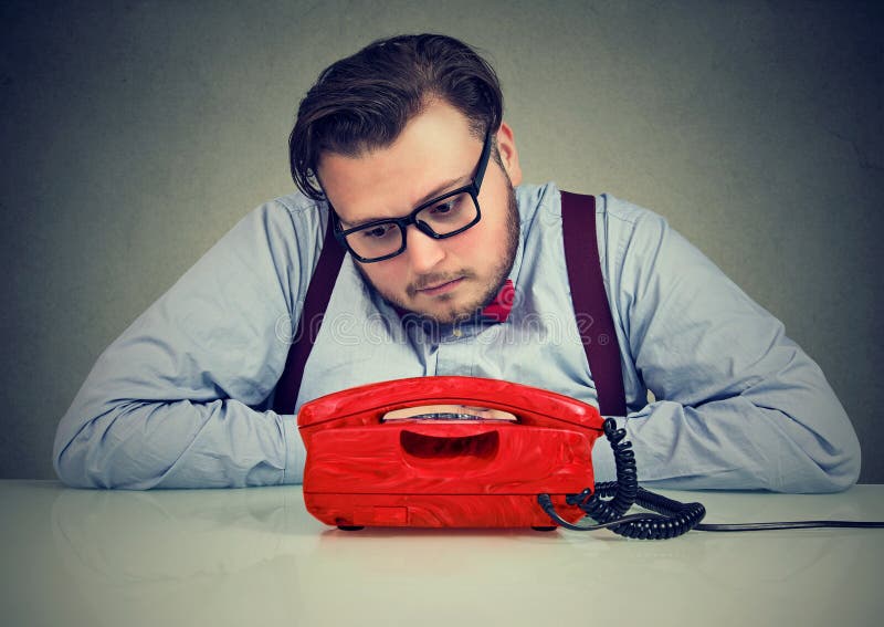Desperate Sad Man Waiting for Someone To Call Him Stock Image - Image ...