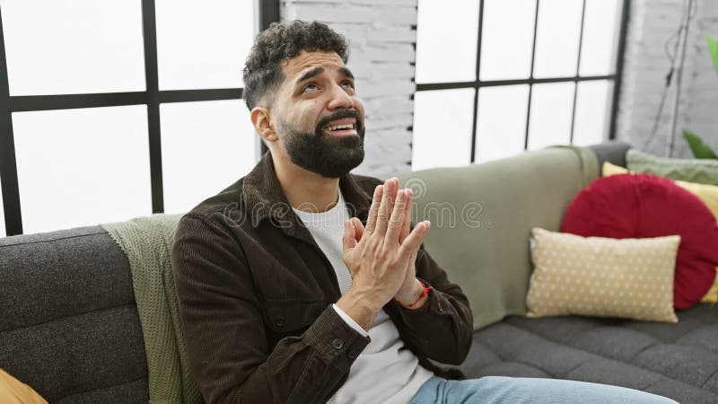 Desperate Young Man at Home, Begging for Help and Praying with Hands ...