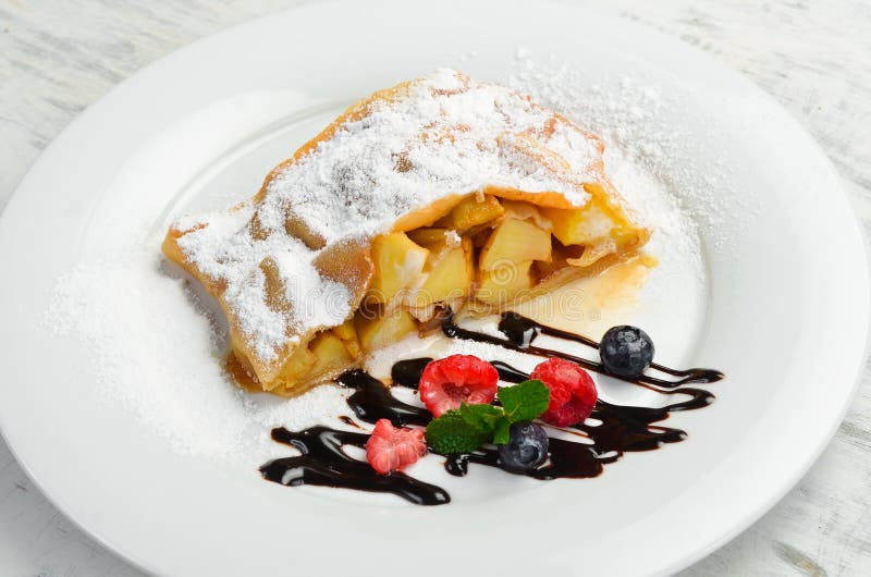 Dessert. Apple Strudel with Berries and Chocolate on a Plate Stock ...