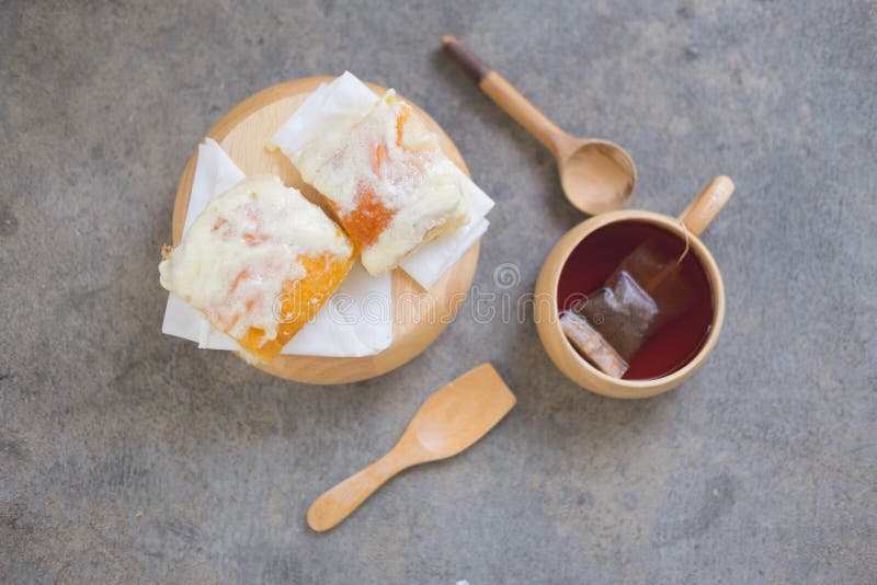 Dessert Bread Dusted with Milk, Sugar and Butter and Hot Tea Stock ...