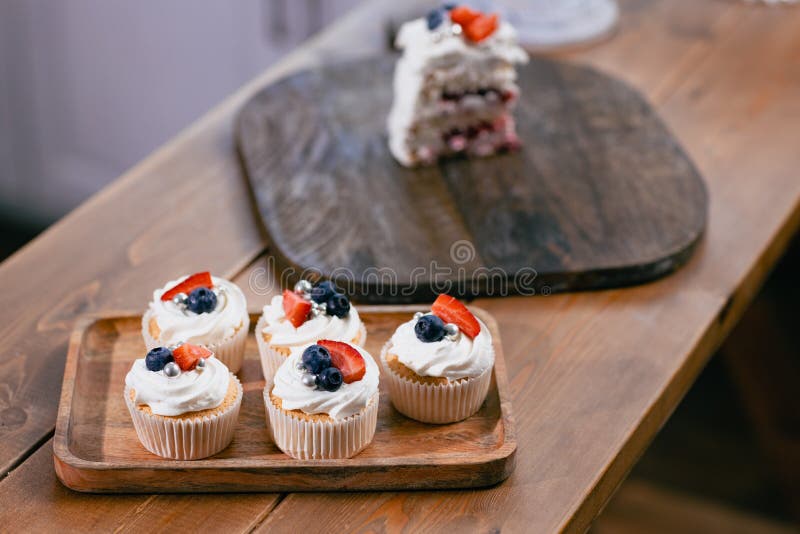 Dessert Cake on Kitchen Table. Cakes Cupcakes and Sweet Dessert. Stock ...