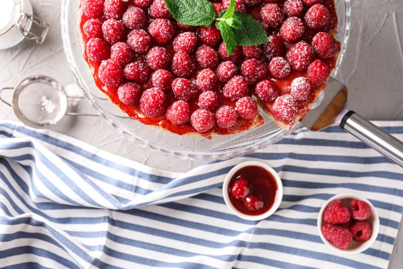 Dessert Stand with Delicious Raspberry Cheesecake on Table Stock Image ...