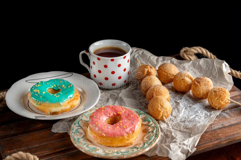 Dessert with Sweet Pink Doughnuts and Cup of Tea. Stock Photo - Image ...