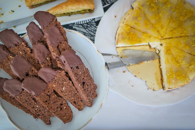 Dessert Table with Chocolate Biscotti and Cheesecake on White Stock ...