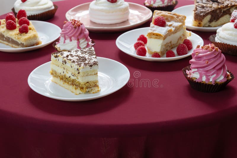 Desserts with Raspberries on White Plates on the Table Stock Photo ...