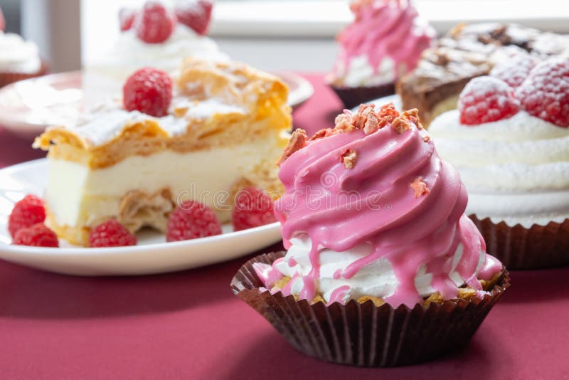 Desserts with Raspberries on White Plates on the Table Stock Image ...