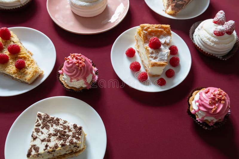 Desserts with Raspberries on White Plates on the Table Stock Photo ...