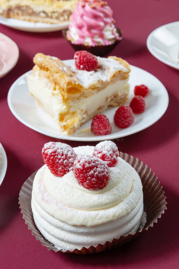 Desserts with Raspberries on White Plates on the Table Stock Image ...