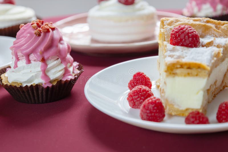 Desserts with Raspberries on White Plates on the Table Stock Image ...