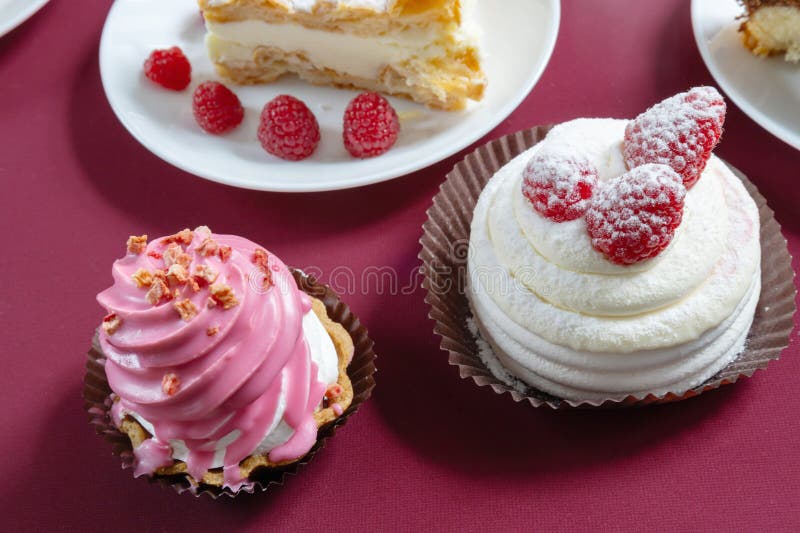 Desserts with Raspberries on White Plates on the Table Stock Photo ...