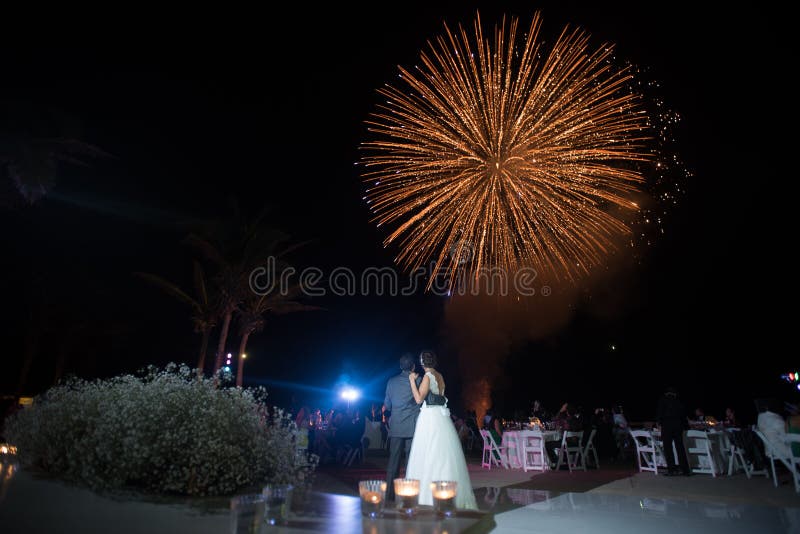 Destination Beach Wedding Fireworks Couple Looking at Editorial Image ...