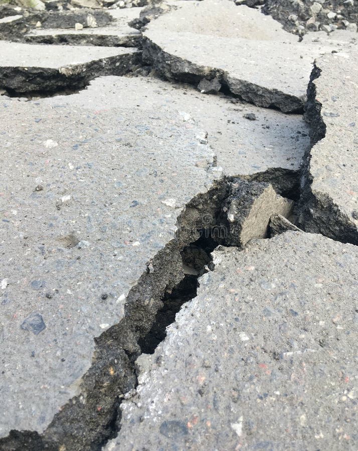 Destroyed Asphalt Cover on Road. Bad Road Condition that Needs Repair ...