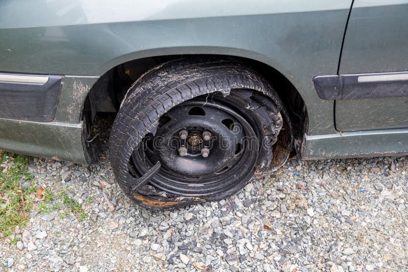 Destroyed Blown Out Tire with Exploded, Shredded and Damaged Tire on a ...