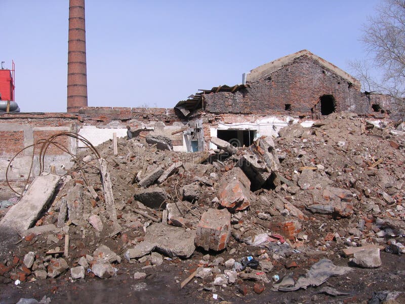 Destroyed Brick Building in the Debris Debris with a Pipe from the ...