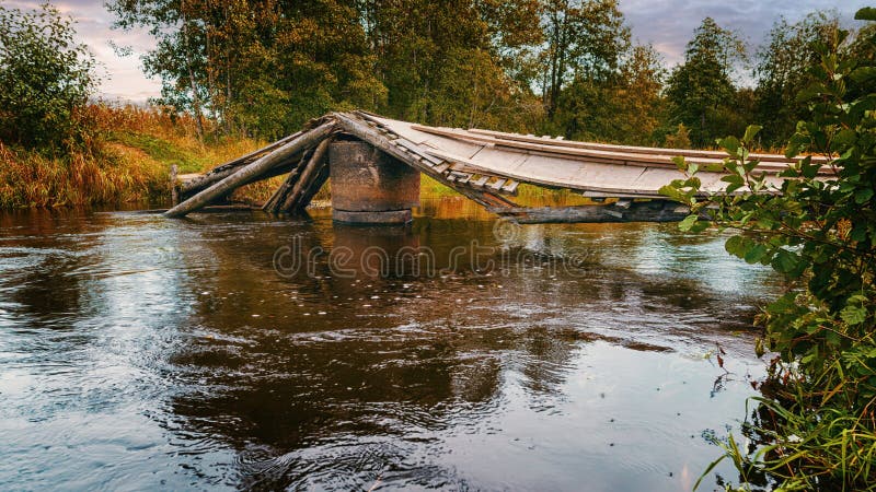 Destroyed Bridge Over a Small Brown River Stock Image - Image of hiking ...