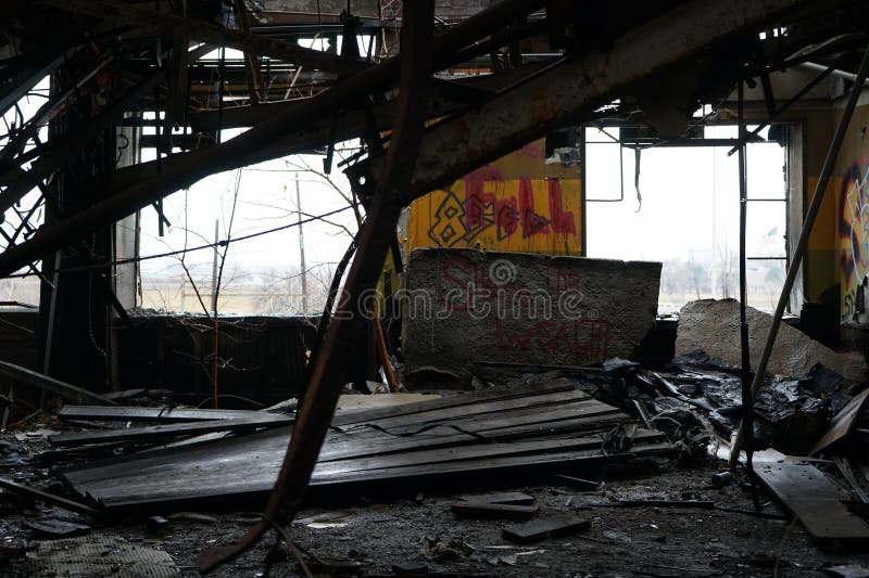 A Destroyed Building with Graffiti on it is Showing a Fire Hydrant ...