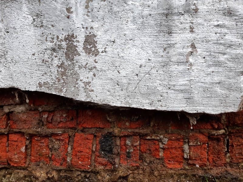 Destroyed Gray Plaster on a Red Brick Wall. Background Stock Photo ...