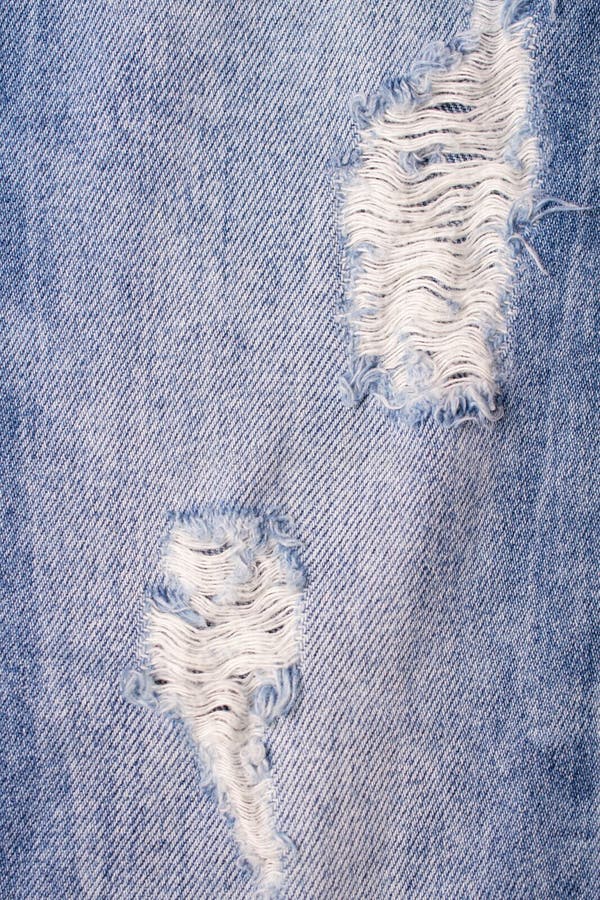 Destroyed Torn Blue Jeans Background. Close Up Blue Ripped Jeans Stock ...