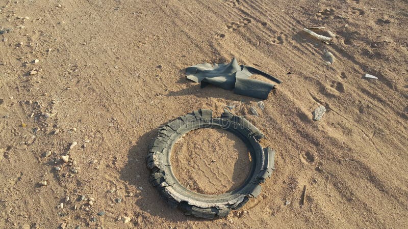 Destroyed tyre in desert stock image. Image of tyre - 181594747