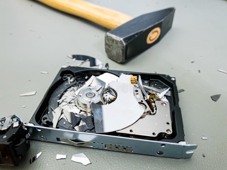 Destroying Computer Hard Drive with a Hammer. Stock Photo - Image of ...