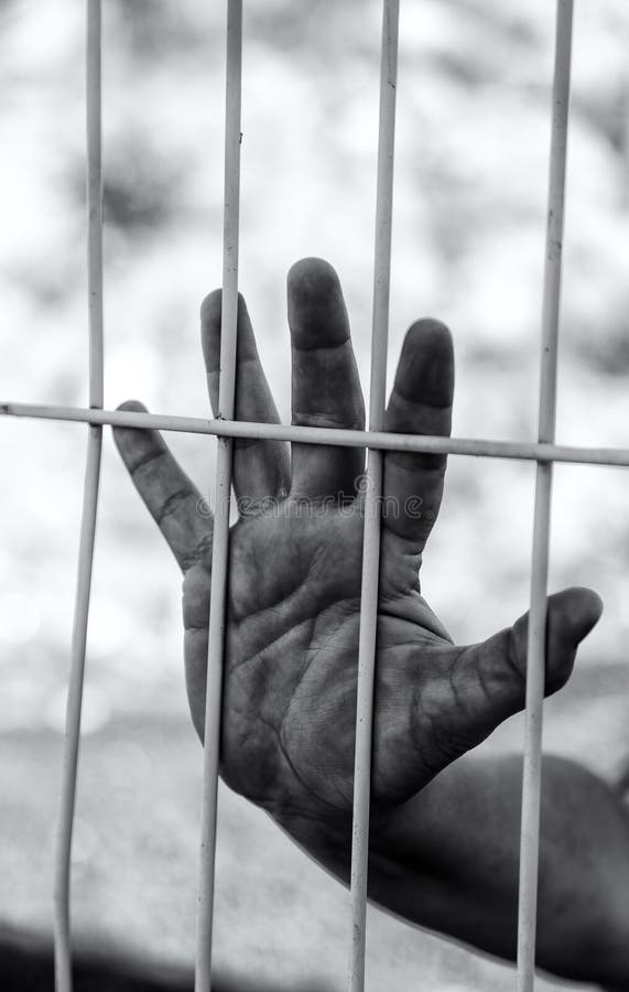 Hands on a fence stock photo. Image of barrier, iron - 253887628