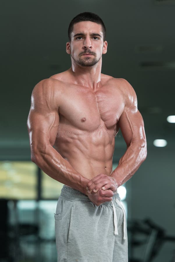 Detail of a Bodybuilder Posing in the Gym Stock Image - Image of ...
