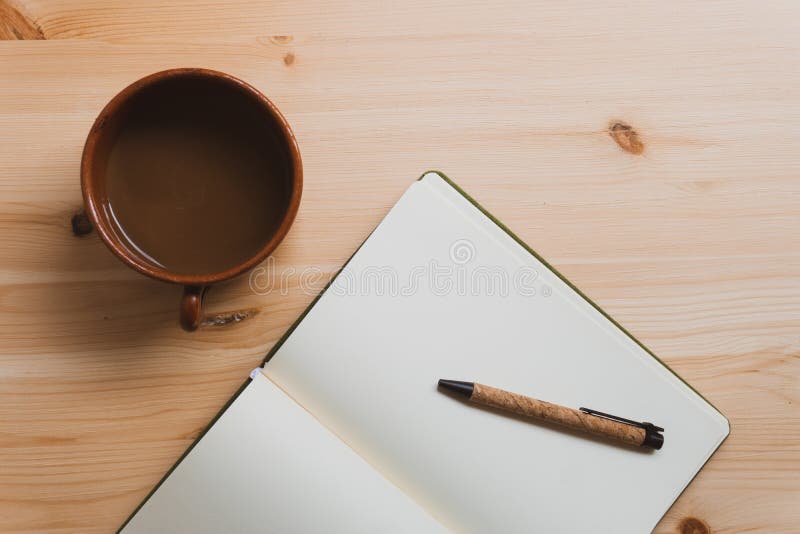 Detail Caption of a Notebook, Pencil and a Cup of Melted Chocolate in ...