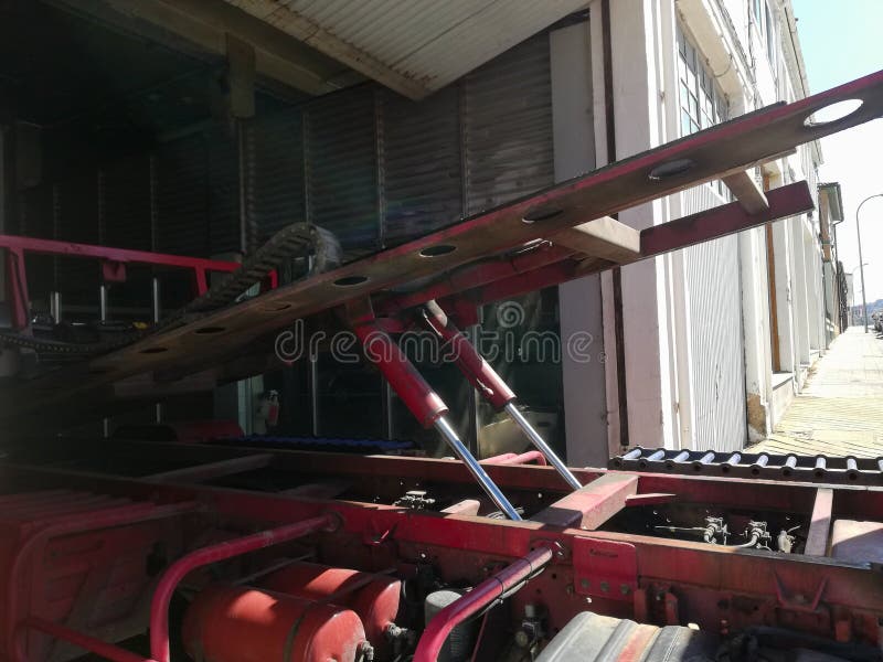 Detail of a Car Tow Truck Unloading a Car in the Workshop Stock Image ...