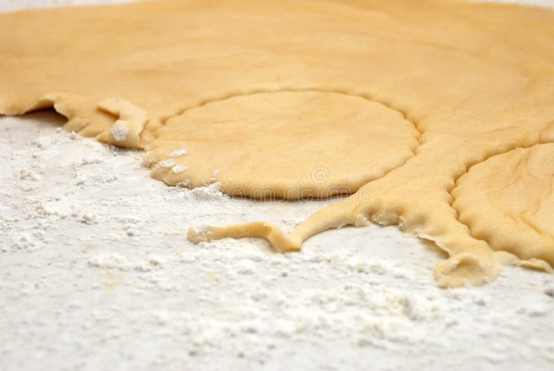 Pastry Circles Being Cut and Filling a Bun Tin To Make Jam Tarts Stock ...