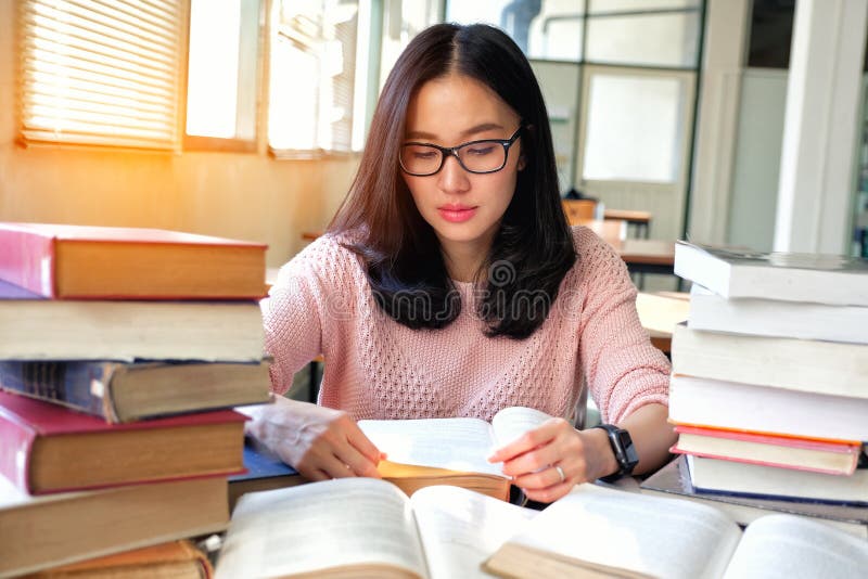 Young Woman Studying in Library Stock Image - Image of laptop, japan ...