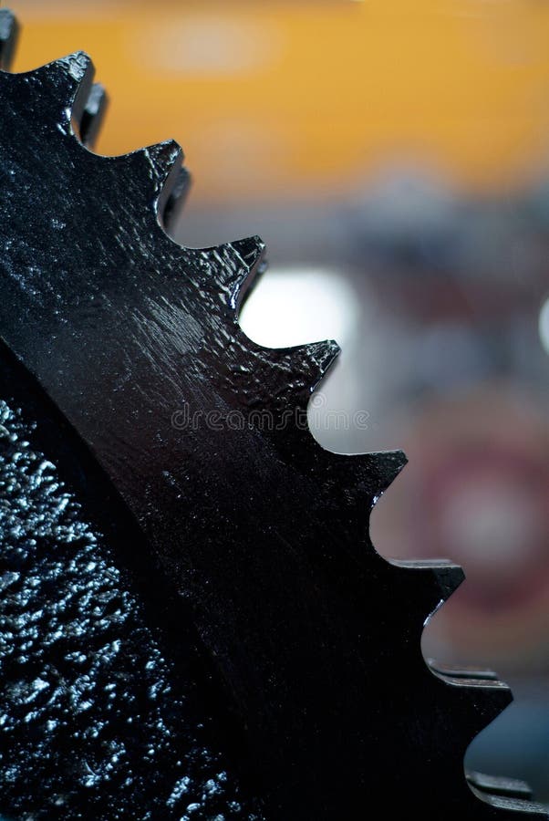 Detail of cogged wheel stock photo. Image of heavy, black - 10134968