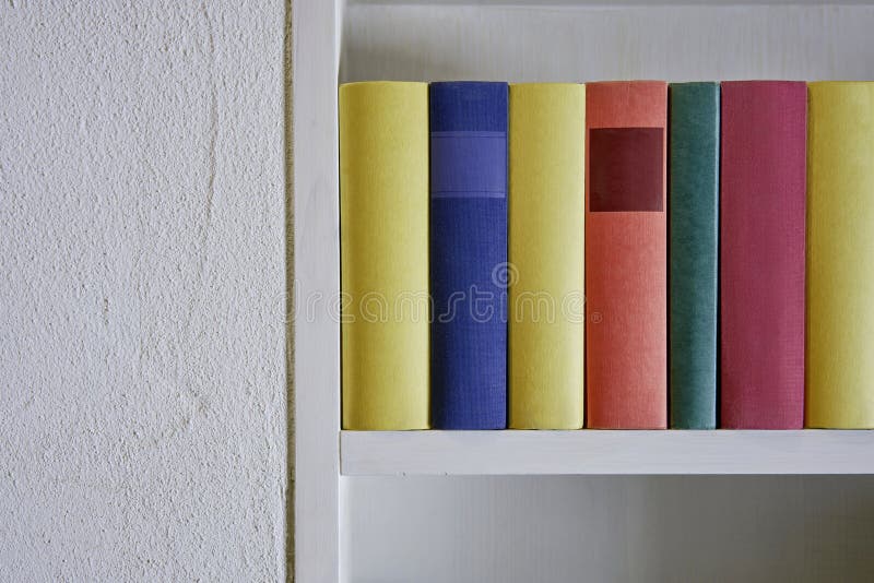 Detail of Colorful Book Covers in a Shelf in White Wall Stock Photo ...