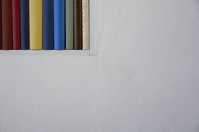 Detail of Colorful Book Covers in White Wall with Copy Space Stock ...