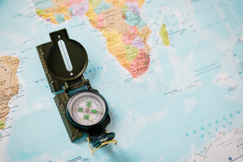 Detail of a Compass Camera on a World Map. Adventure Travel Concept ...