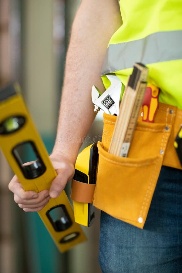 Detail of Construction Worker on Building Site Wearing Tool Belt Stock ...