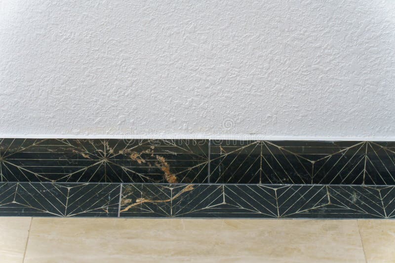 The Detail of the Corner Baseboard on the Wall and Granite Tiles on the ...